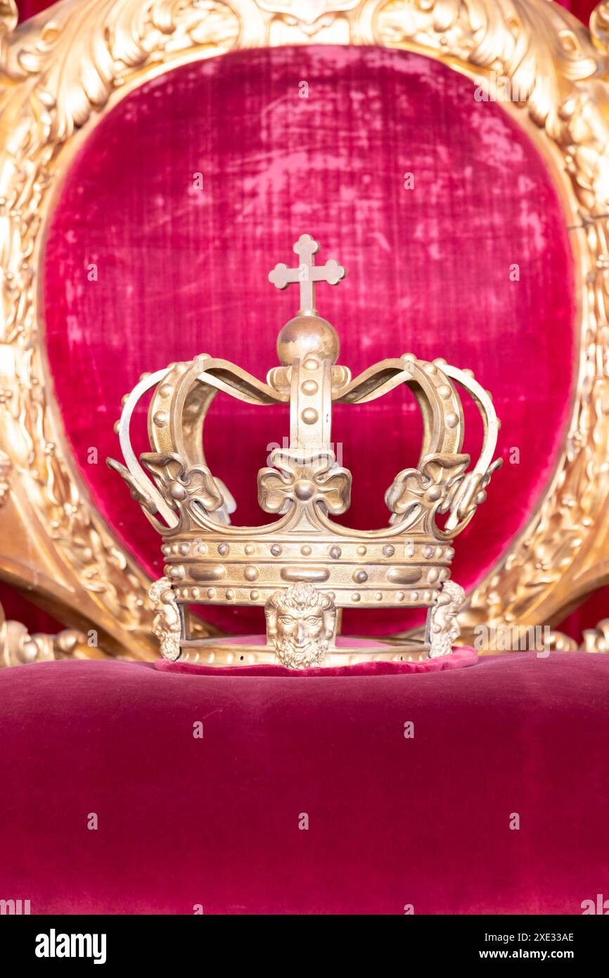 Ancient crown on red velvet. Antique symbol of authority, luxury ...