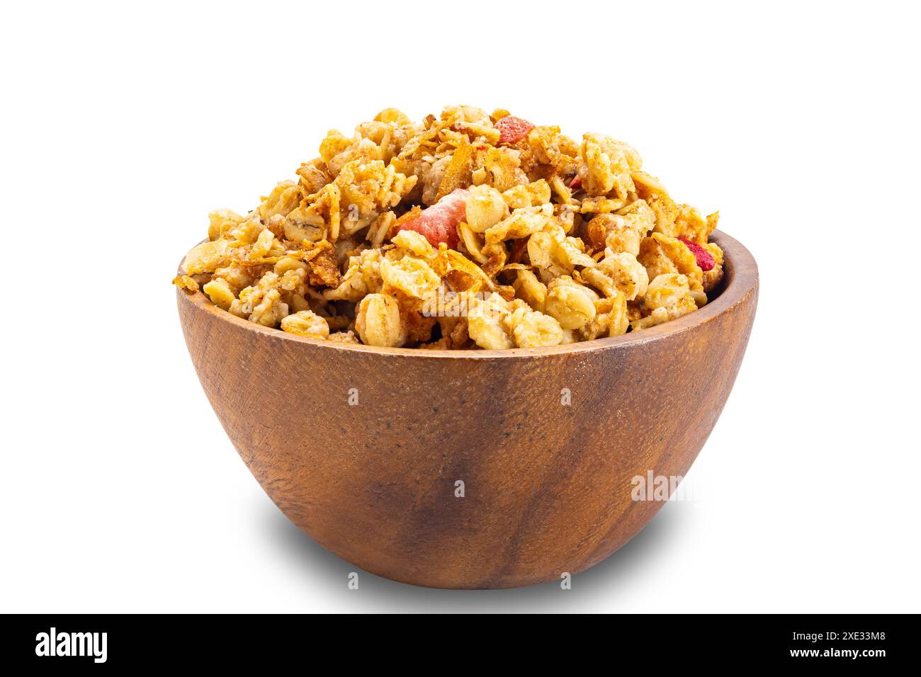 Delicious crunchy muesli with strawberry and raspberry in wooden bowl ...