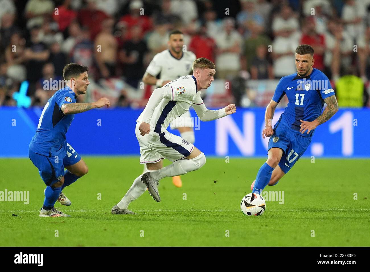 England's Cole Palmer (centre) attempts to go past Slovenia's Erik ...