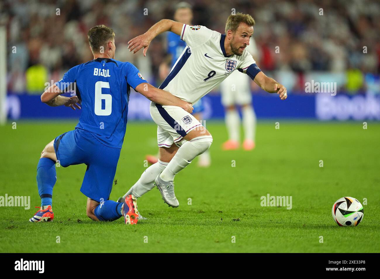 England's Harry Kane (right) goes past Slovenia's Jaka Bijol during the ...