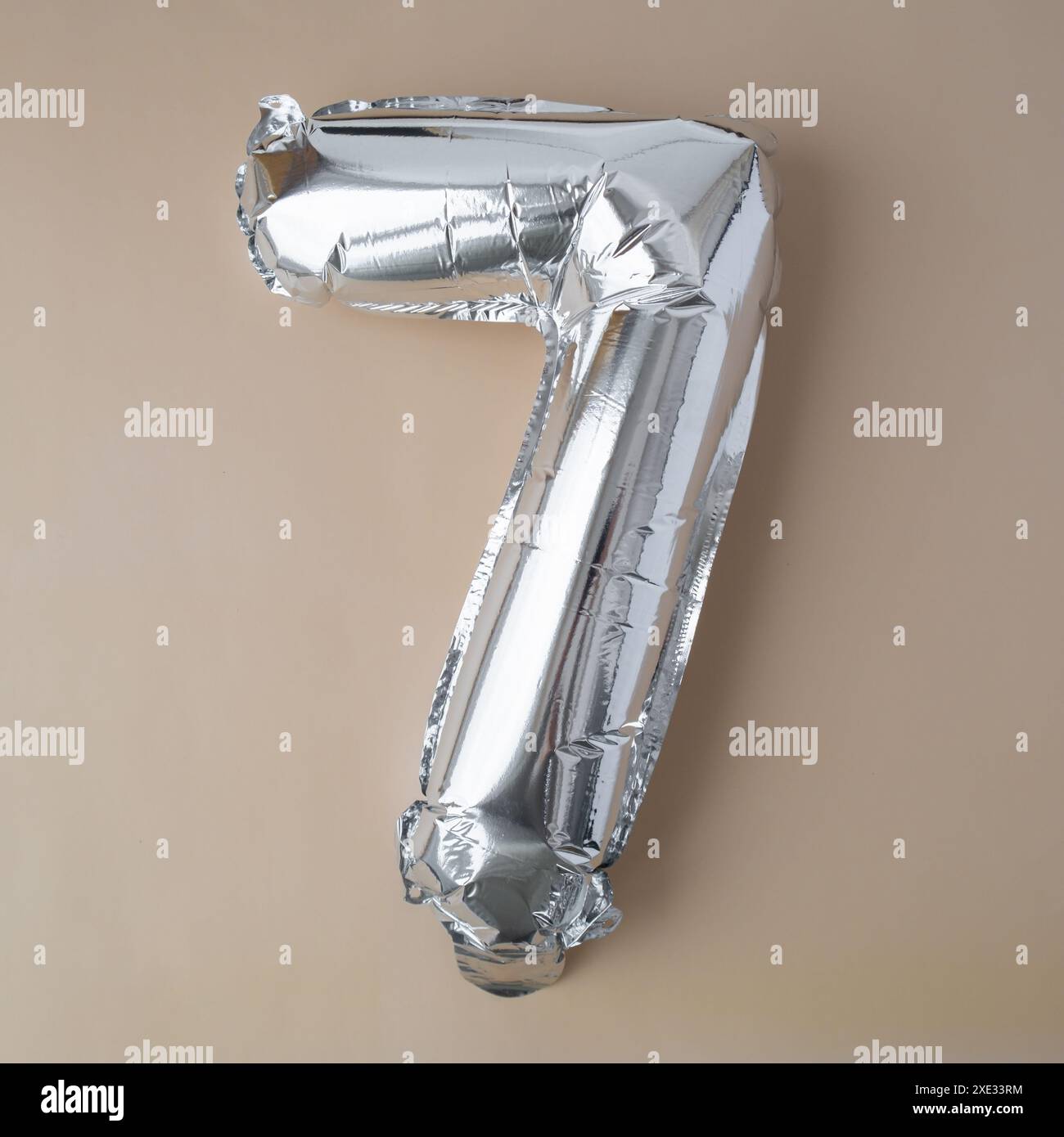 7 seven metallic balloon on beige neutral background. Greeting card ...