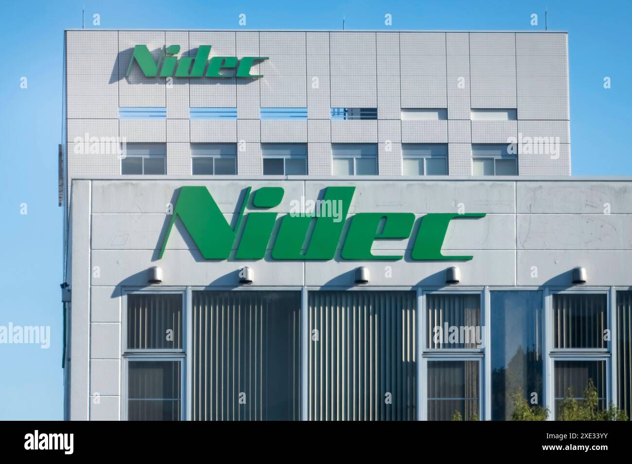 A Nidec Corporation logo. A Japanese manufacturer and distributor of ...