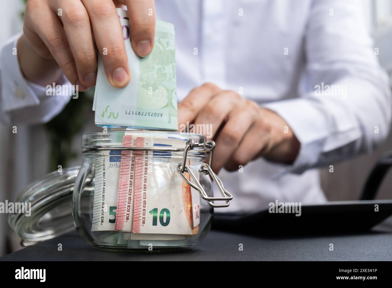 Man collecting counting money euro hi-res stock photography and images ...