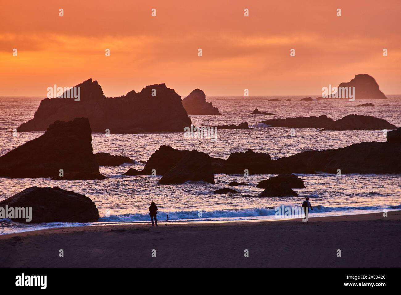 Sunset at Harris Beach Oregon with Silhouetted Rocks and Photographers ...