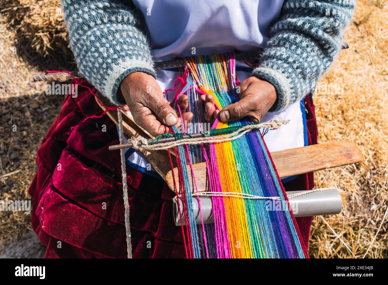 poor indigenous adult woman artisan with blue mask and typical ...