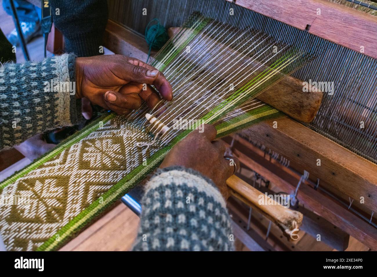 poor indigenous adult woman artisan with blue mask and typical ...