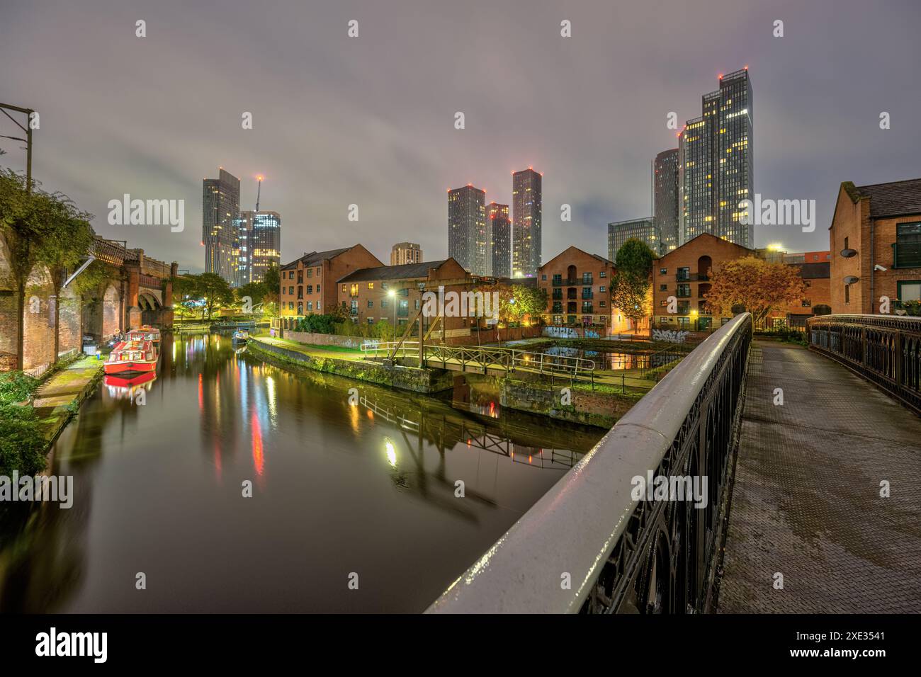 Castlefield in Manchester, UK, at night with the modern skyline in the ...