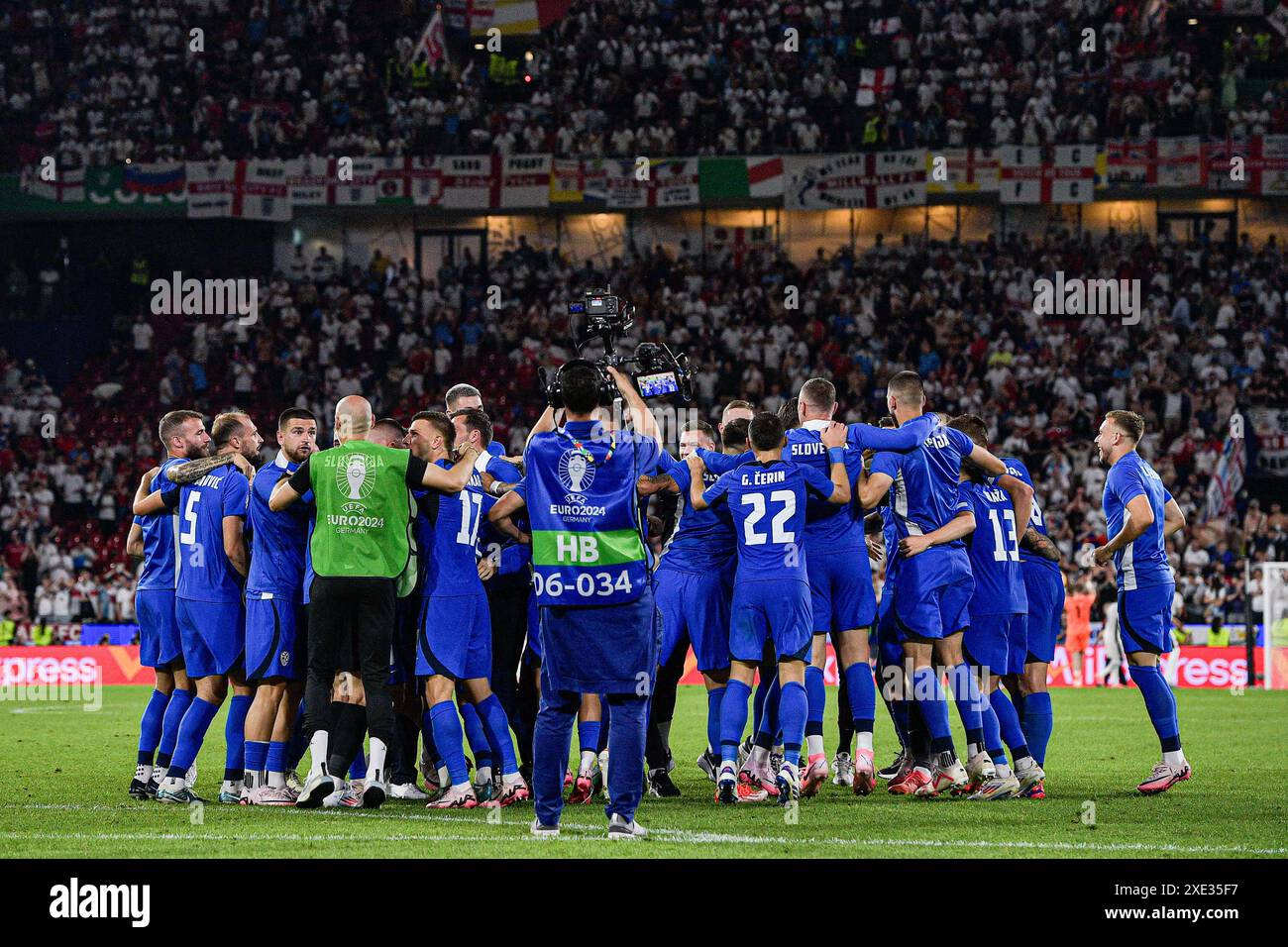 COLOGNE, GERMANY - JUNE 25: players of Slovenia celebrate the win ...