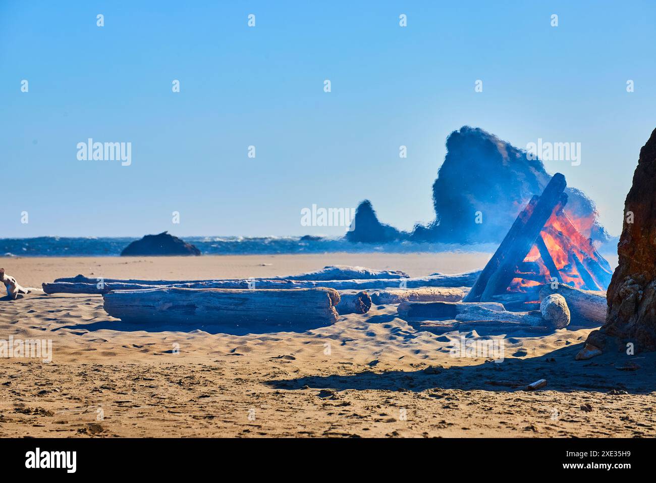 Bonfire on Oregon Beach with Crashing Waves at Eye Level Stock Photo ...