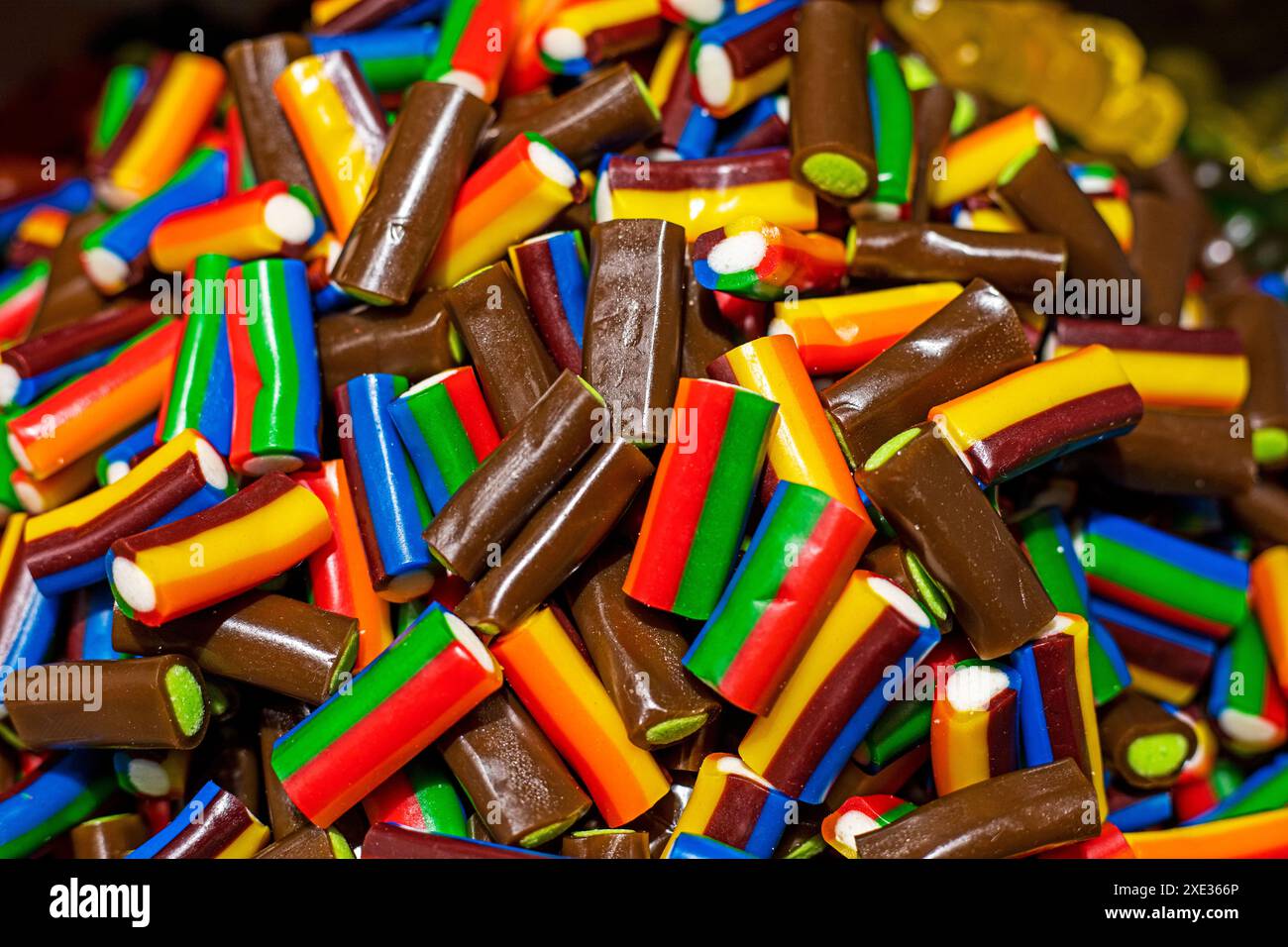 background of multi-colored chewing candies with licorice. medicinal ...