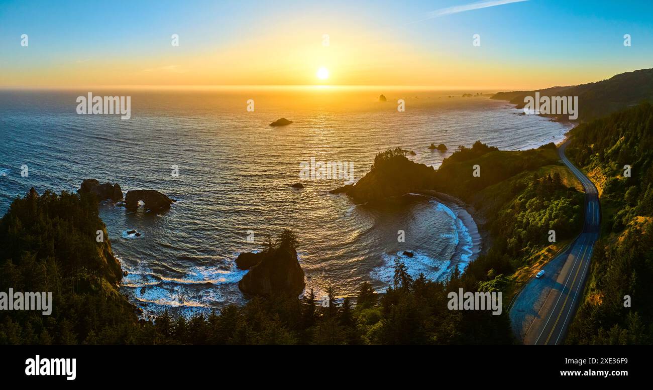 Aerial Sunset Over Serene Coastal Road and Shimmering Ocean Stock Photo ...