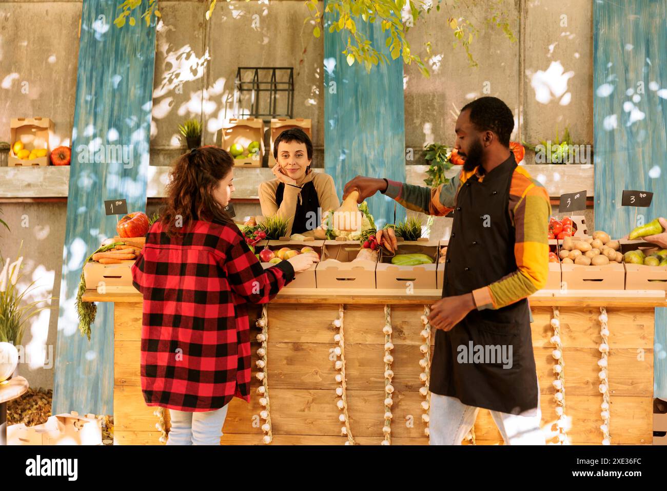 Multicultural people browse locally grown fresh fruits and veggies in ...