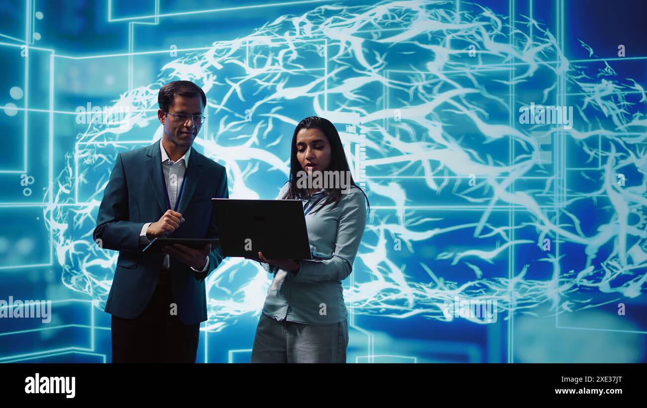 Teamworking colleagues using AI neural networks modeled after human brain to solve complex ...