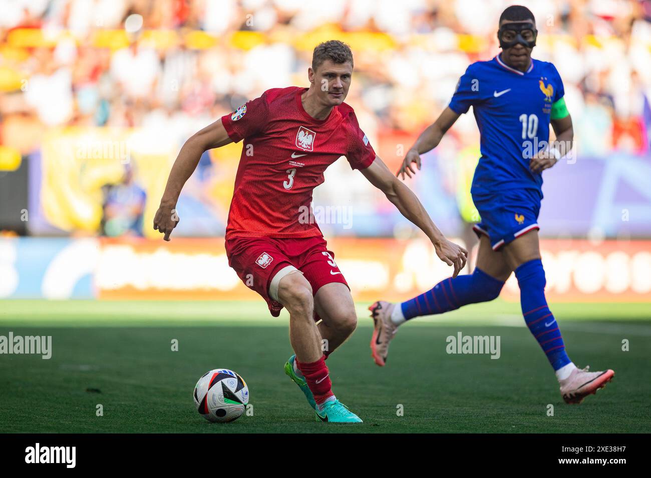 Pawel Dawidowicz (L) of Poland and Kylian Mbappe (R) of France are seen ...