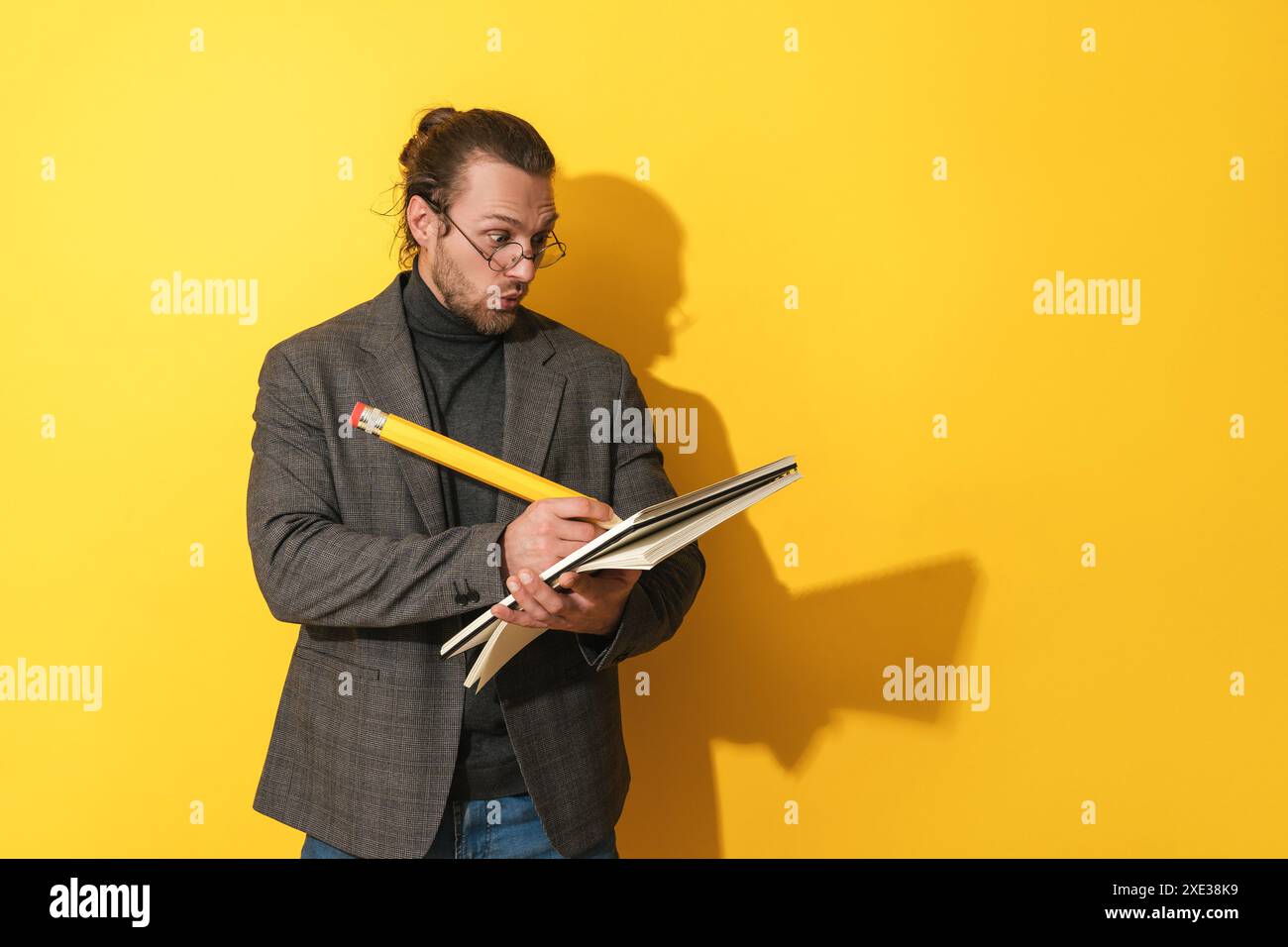 Portrait funny man holding pencil hi-res stock photography and images ...