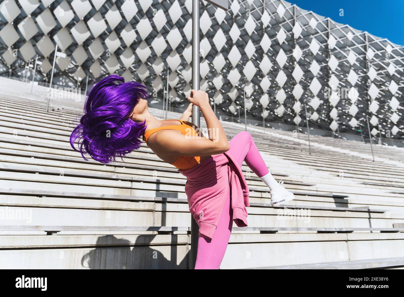 Carefree woman dancer wearing colorful sportswear having fun on the ...