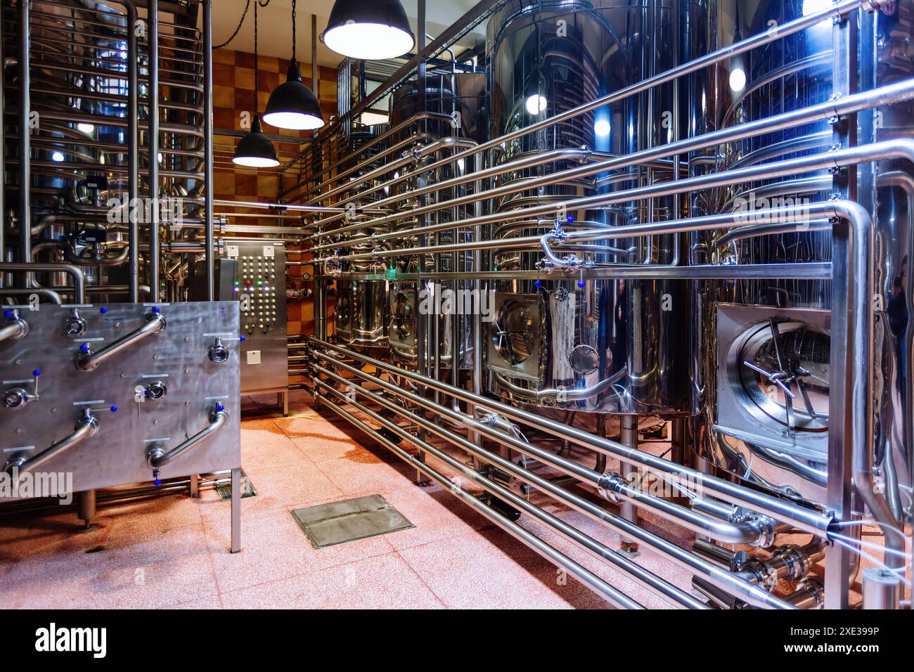 Vats for fermentation. Craft beer production line in modern brewery ...
