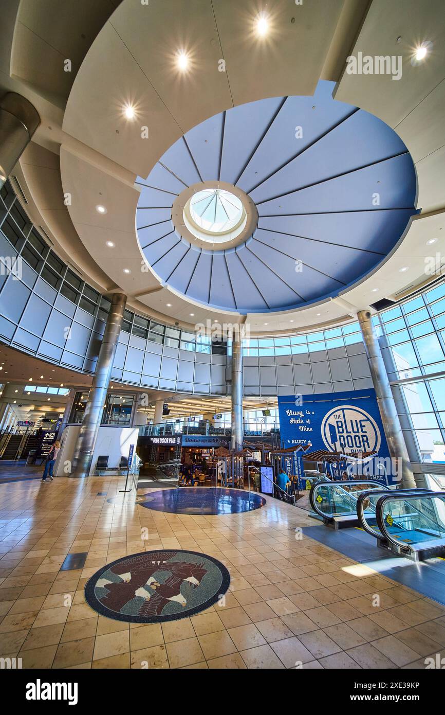 Modern Public Atrium with Blue Skylight Structure and Motion Below Low ...