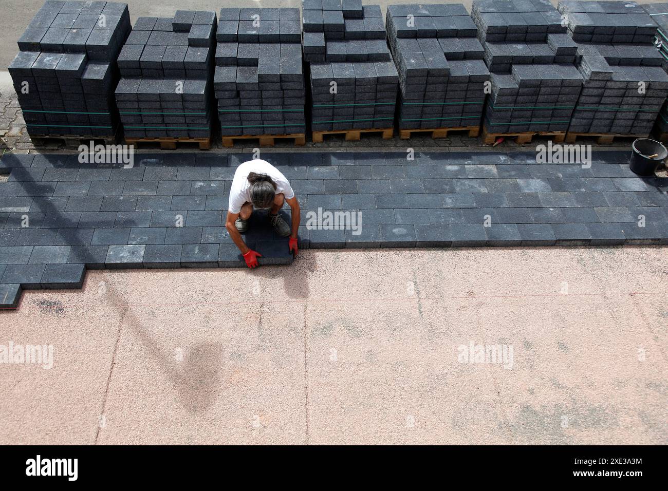 Construction of pavement and wooden pallets. Laying concrete paving ...