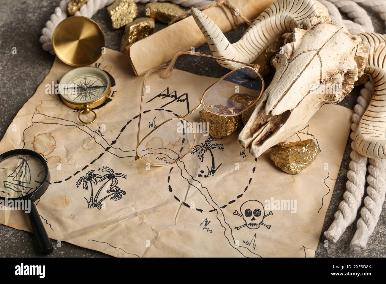 Sheep scull with travel equipment, scroll and golden nuggets on grunge ...