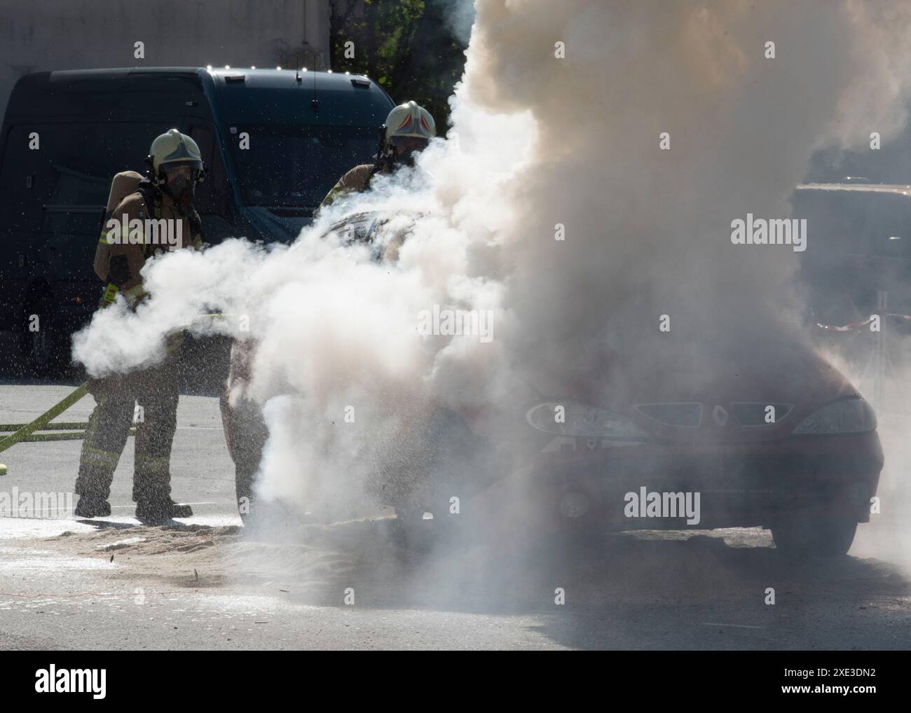 Firefighting on street accidents Stock Photo - Alamy