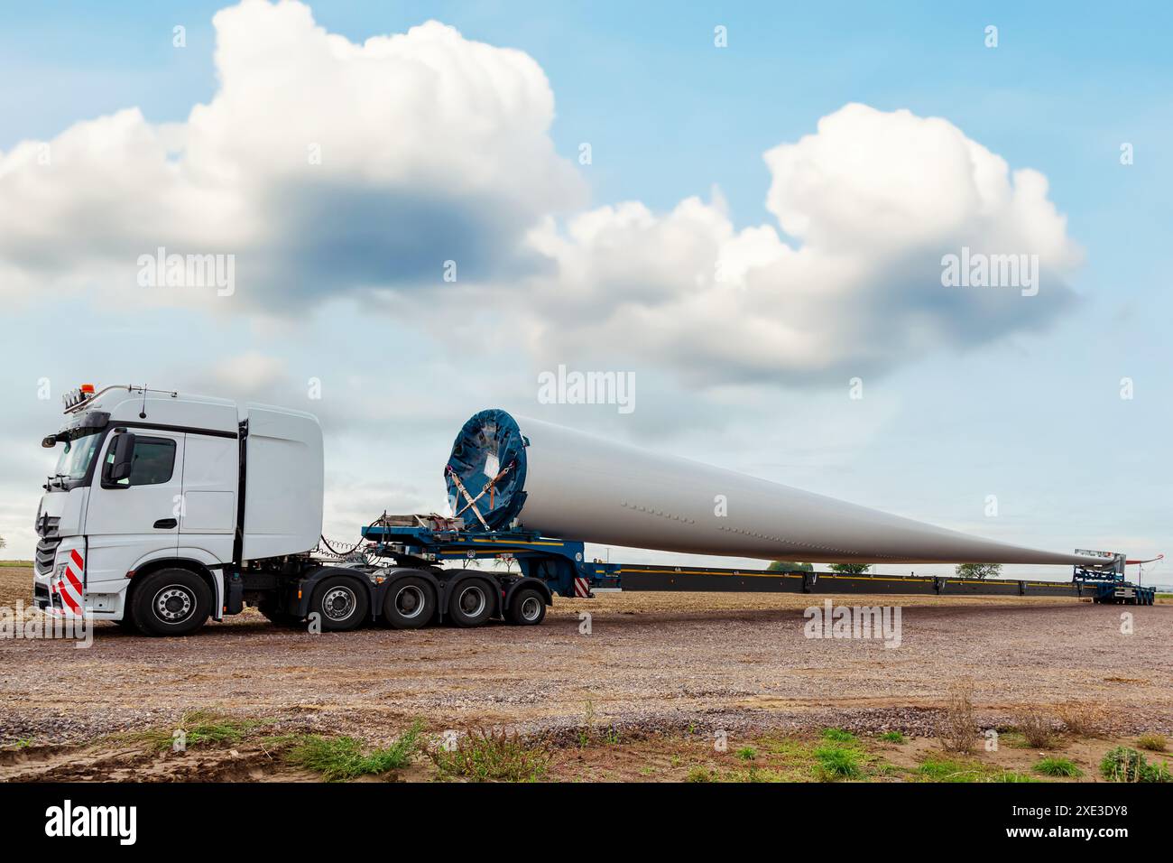Truck on field. Blade for wind turbines. Special transport of a blade ...