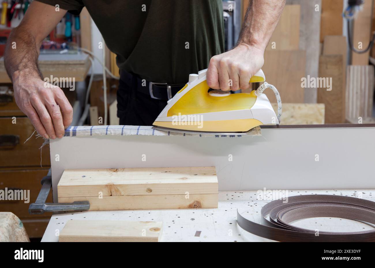 Iron on the wood veneer edge. cabinet wood with Iron-on Edge Banding ...