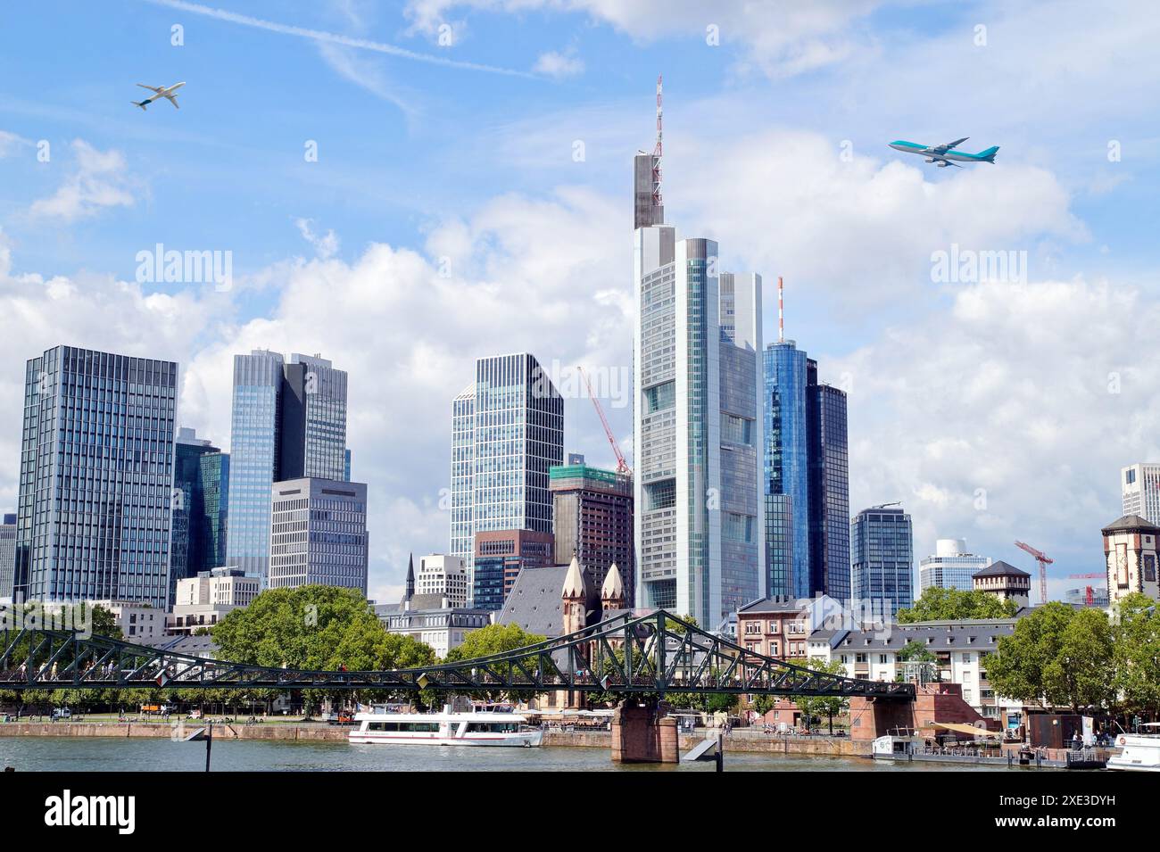 River - Main with european city skyline. Airliner is flying, Jet plane ...