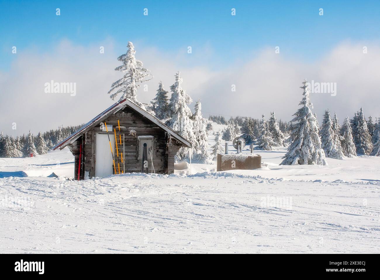 Wooden alpine house covered with snow, ski slope Stock Photo - Alamy
