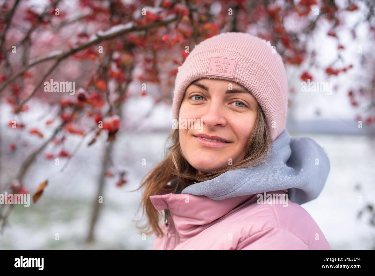 Winter lifestyle portrait of cheerful pretty girl. Smiling and having ...
