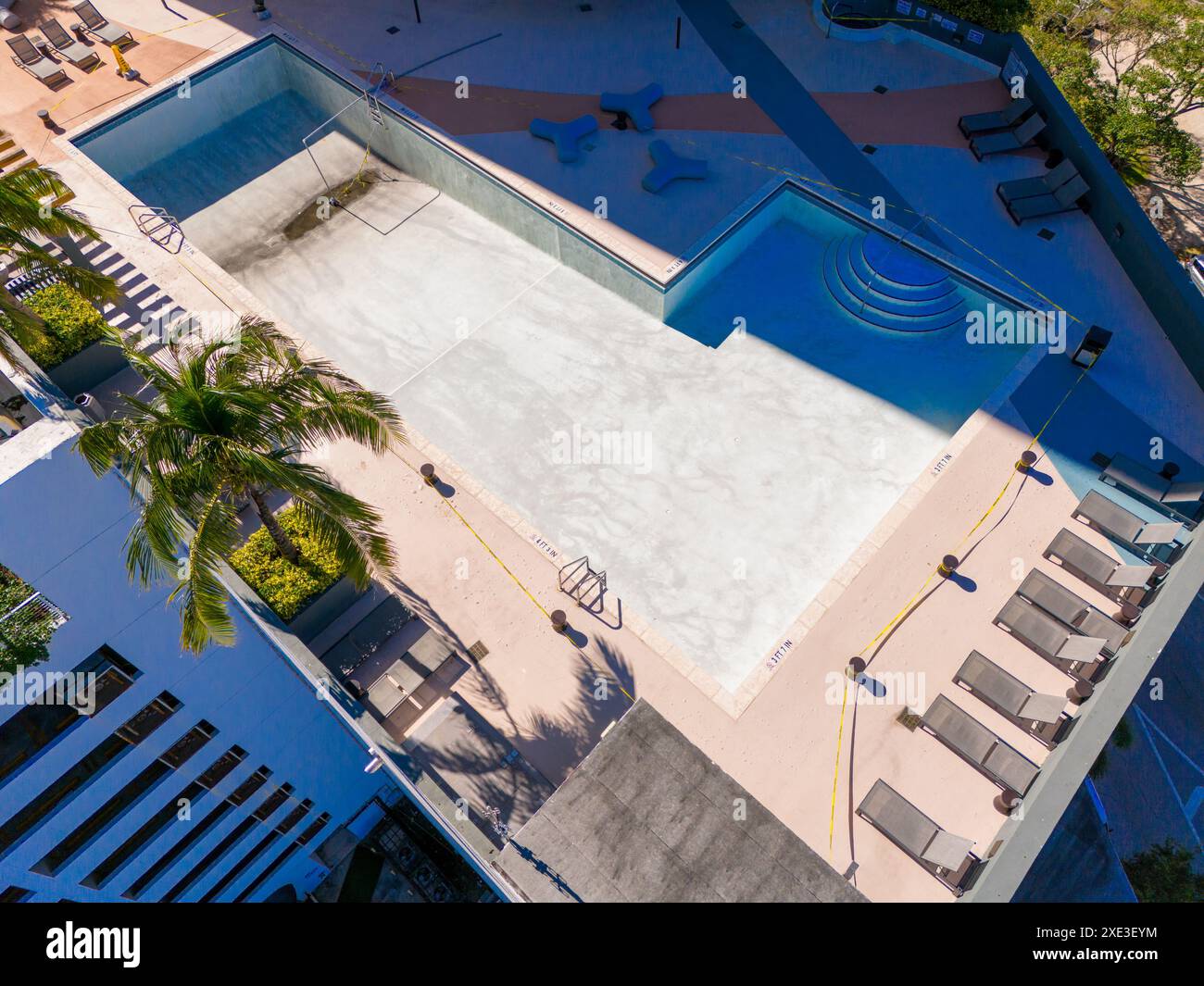 Aerial photo of a swimming pool drained of all water for resurfacing ...