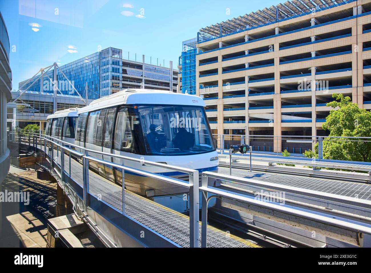 Automated People Mover Train at Airport in Motion with Clear Blue Sky ...
