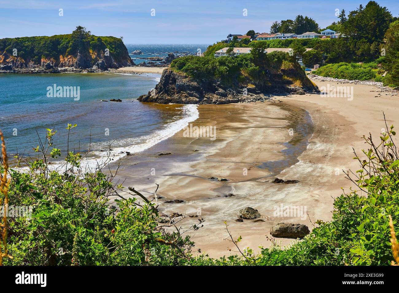 Secluded Sandy Beach with Cliffs and Houses from Eye Level Perspective ...