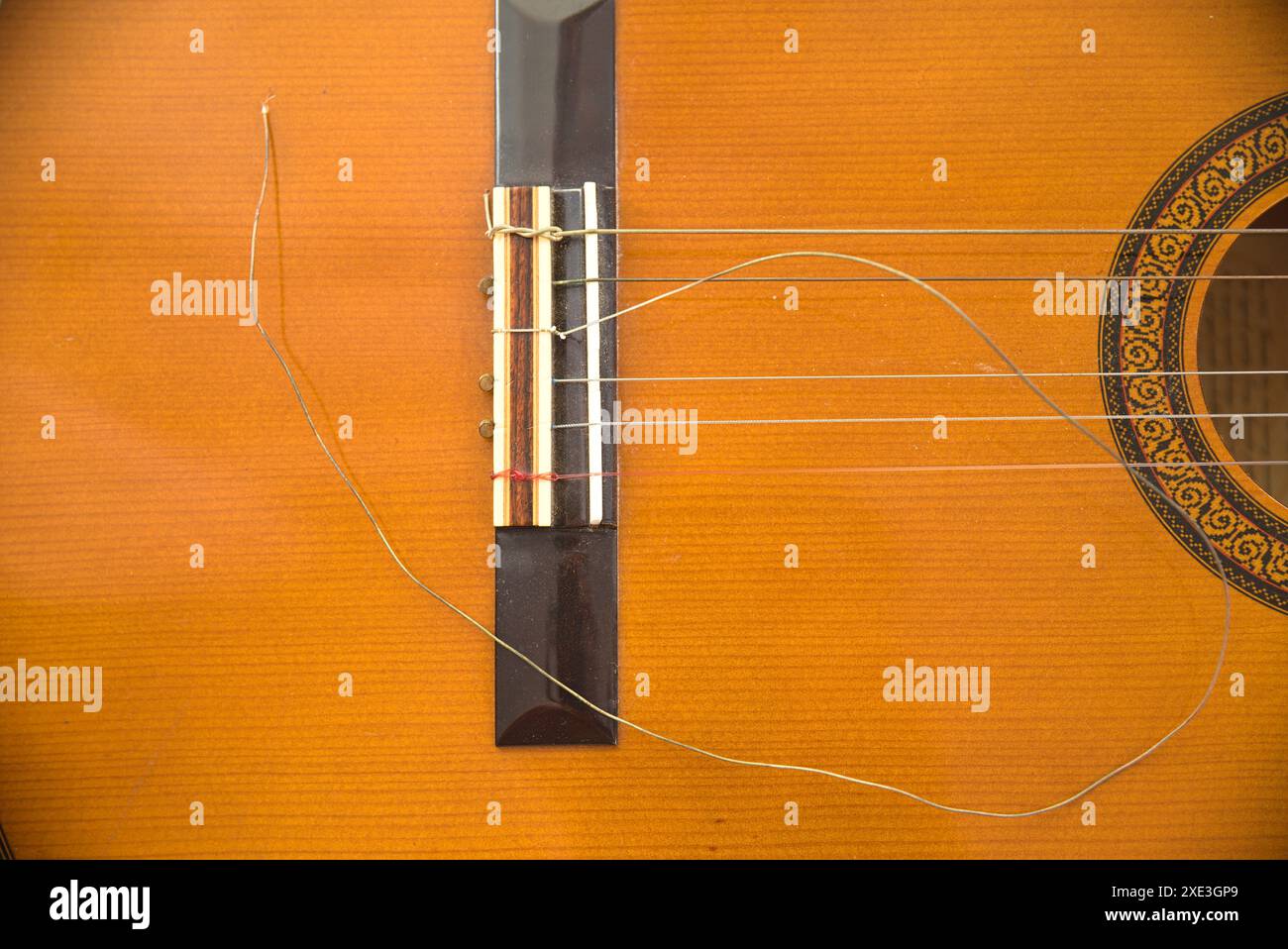 Broken string of classical musical instrument guitar - closeup Stock ...