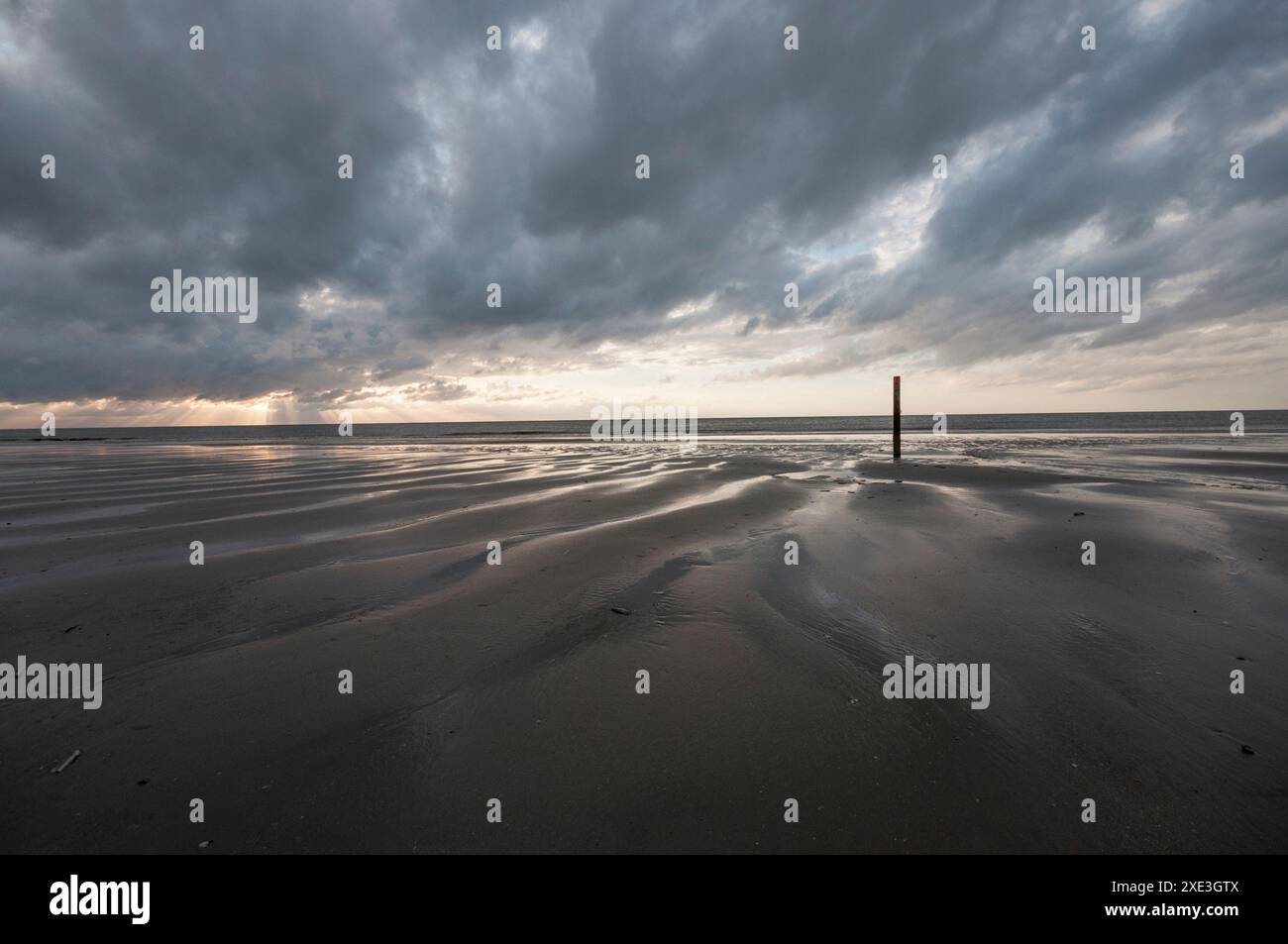Cold sunny weather with storm and heavy clouds on the beach of the ...