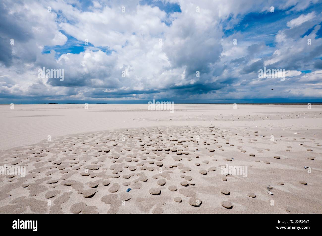 Cold sunny weather with storm and heavy clouds on the beach of the ...
