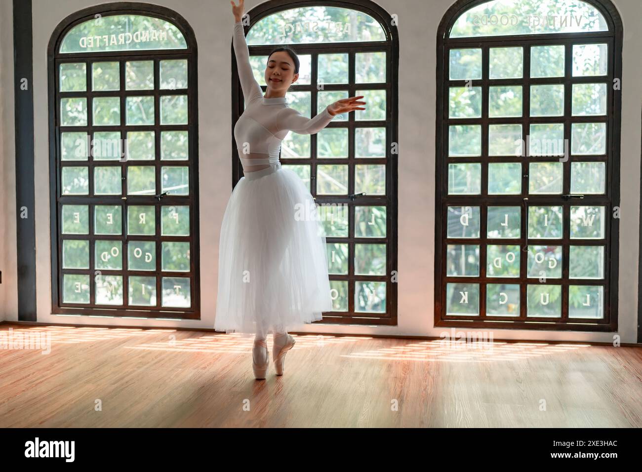 Asian girl ballet dancer creative performance with white skirt ...