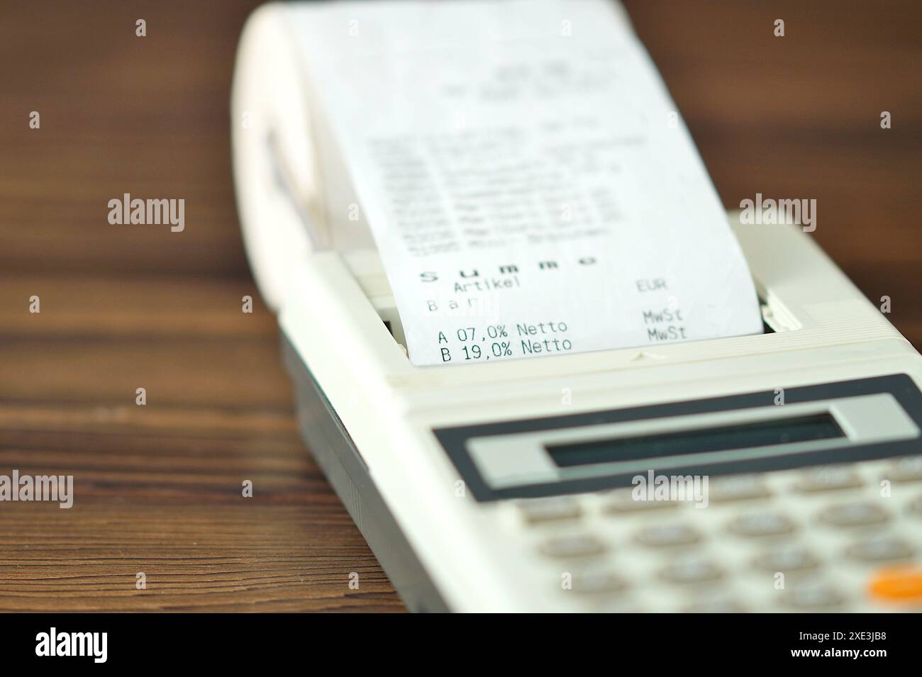 German cash sales receipt in calculator. Invoice with vat tax value ...