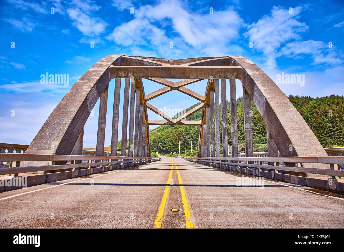 Concrete Arch Bridge in Forested Area with Roadway View Stock Photo - Alamy