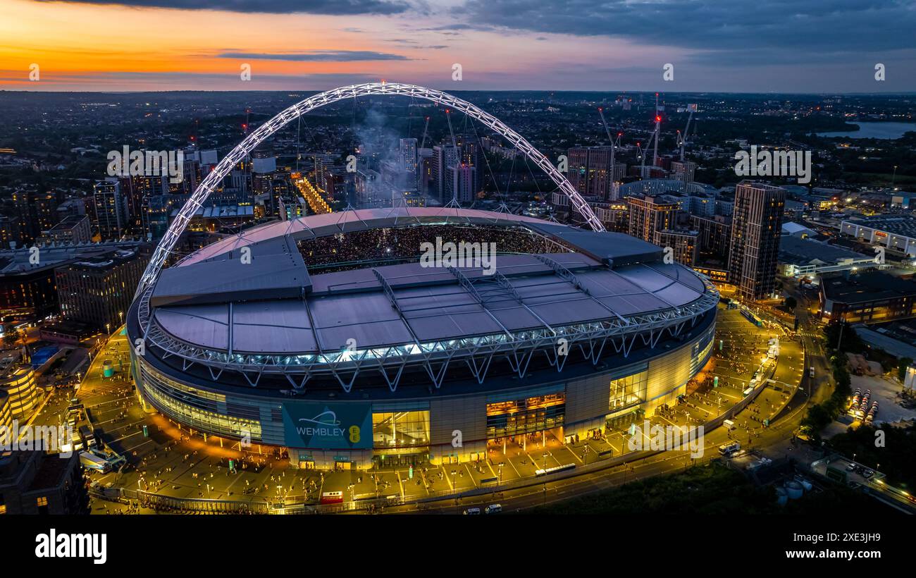 Aerial view of concert at Wembley stadium at sunset in London, England ...