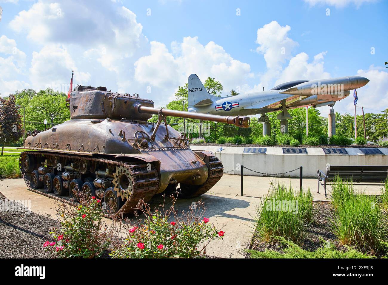 WWII Tank and Vintage Jet Fighter in Outdoor Park Eye-Level View Stock ...