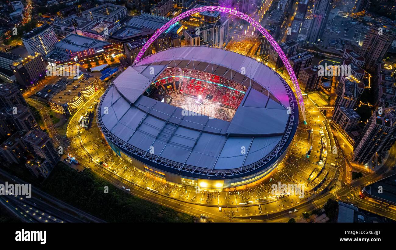 Aerial view of concert at Wembley stadium at sunset in London, England ...