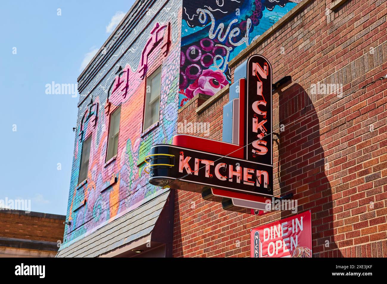 Vibrant Nick's Kitchen Diner Sign and Mural of Urban Eatery Daytime ...