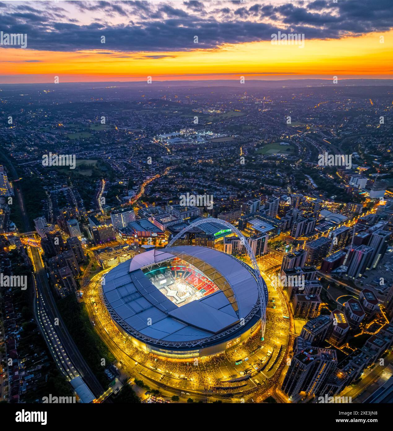 Aerial view of concert at Wembley stadium at sunset in London, England ...