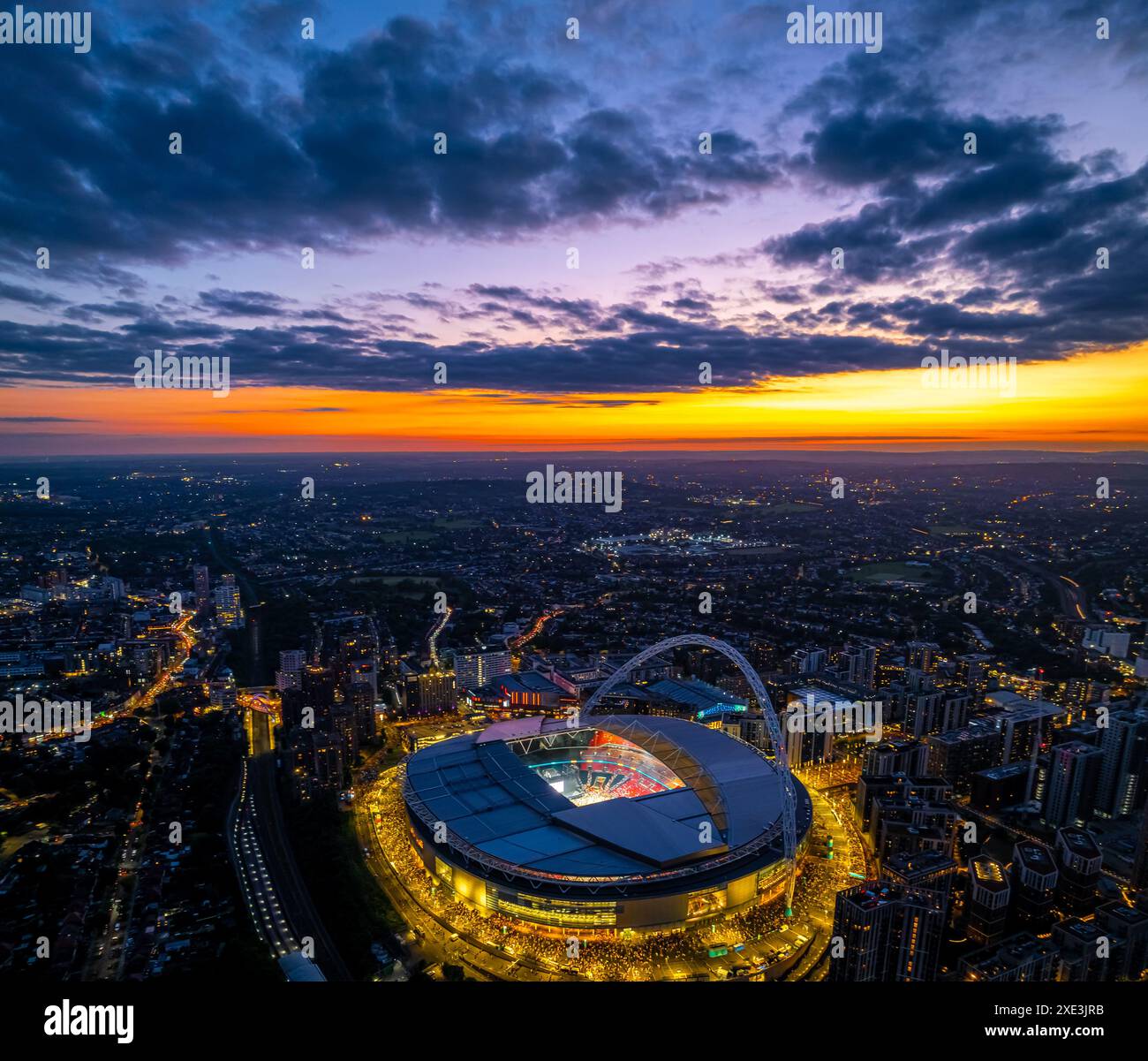 Aerial view of concert at Wembley stadium at sunset in London, England ...