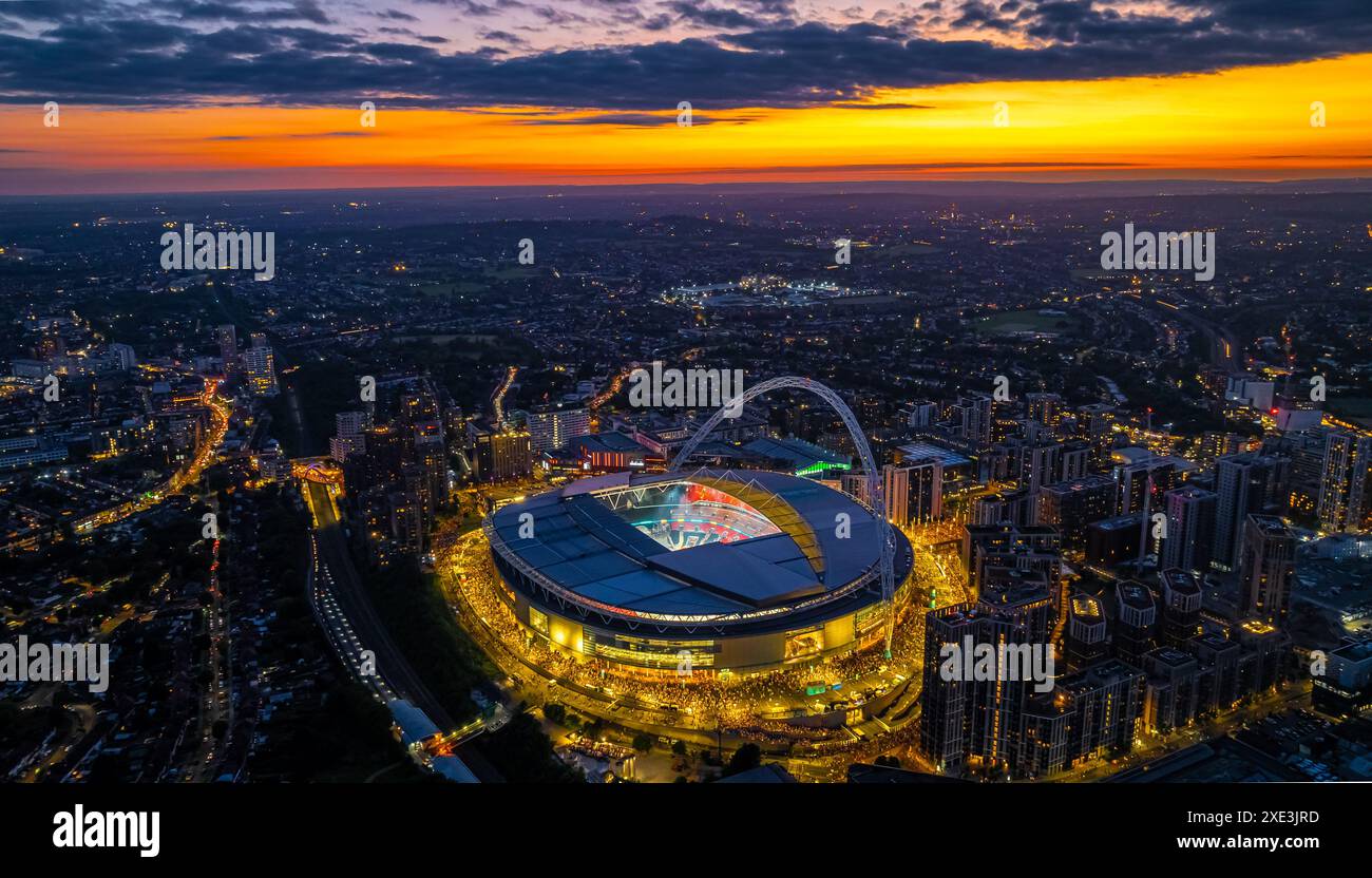 Aerial view of concert at Wembley stadium at sunset in London, England ...