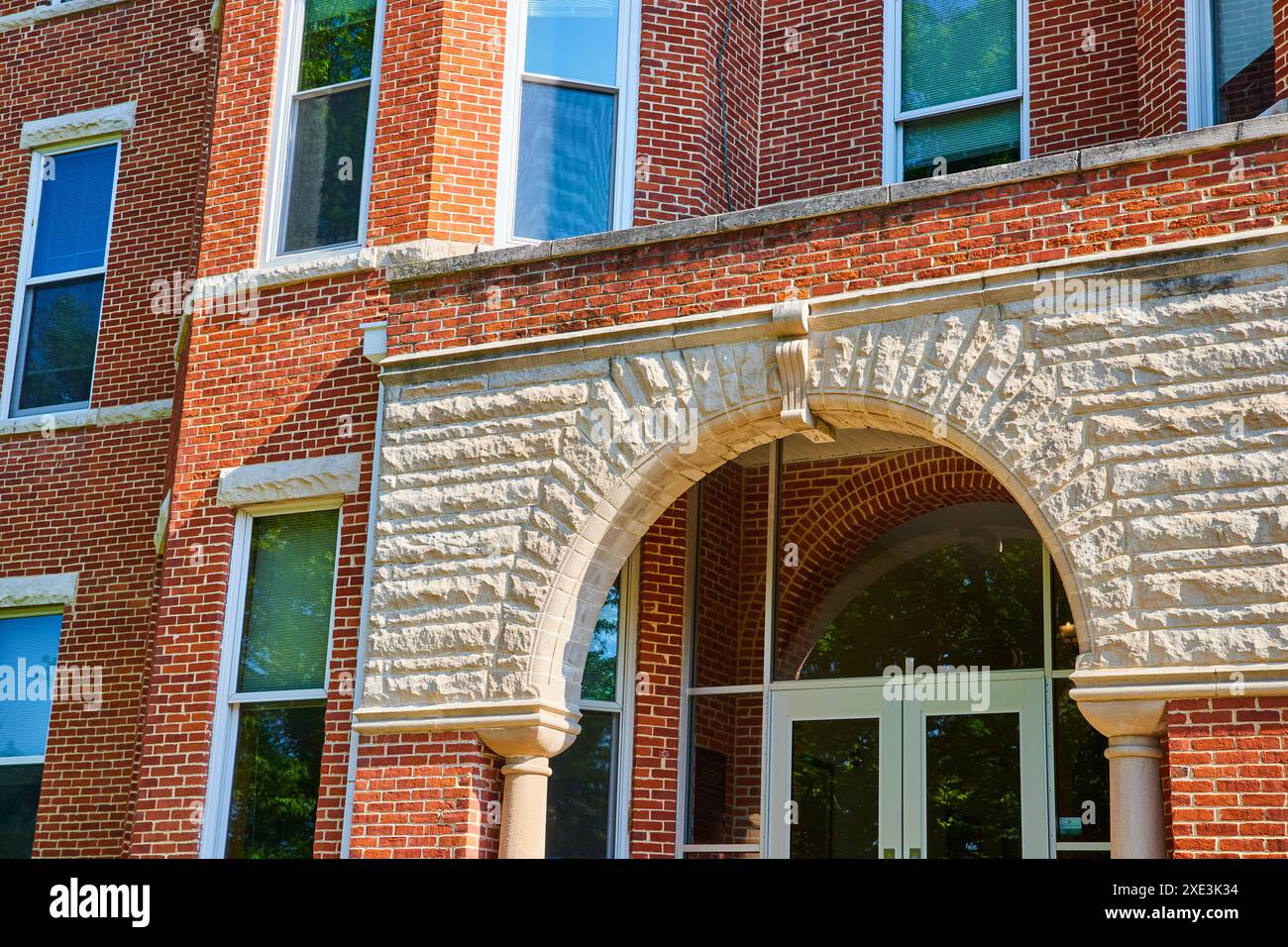 Traditional Brick and Stone Architecture with Arched Entryway Eye-Level ...
