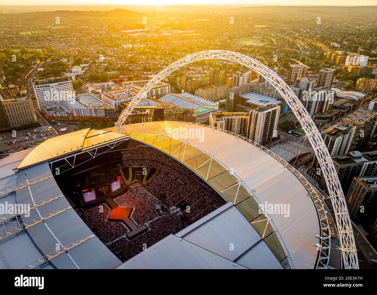 Aerial view of concert at Wembley stadium at sunset in London, England ...
