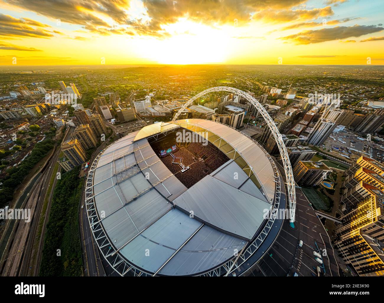 Aerial view of concert at Wembley stadium at sunset in London, England ...