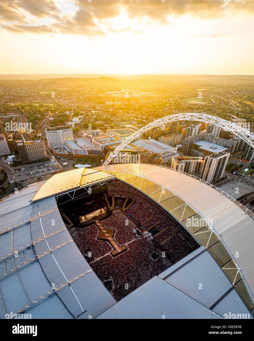 Aerial view of concert at Wembley stadium at sunset in London, England ...